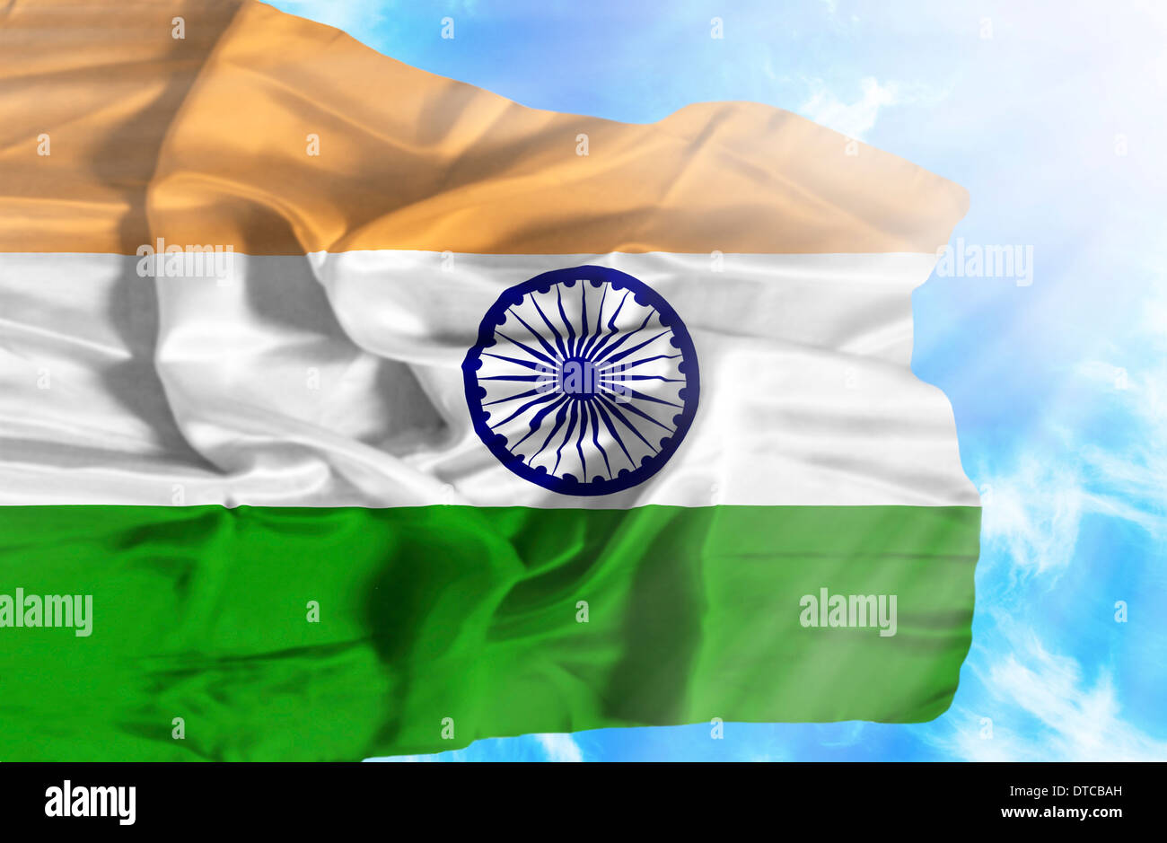 India waving flag against blue sky with sunrays Stock Photo - Alamy