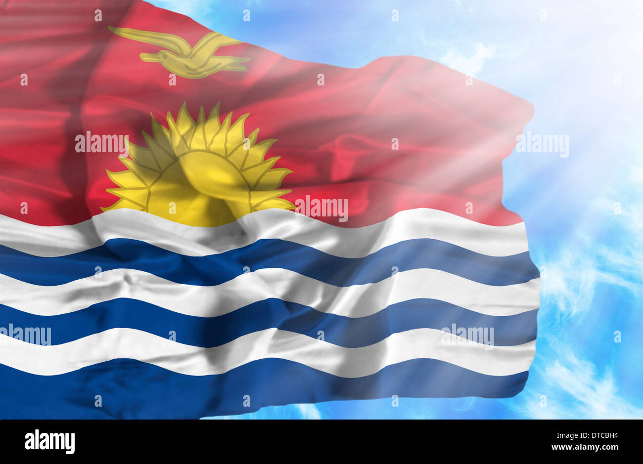 Kiribati waving flag against blue sky with sunrays Stock Photo - Alamy