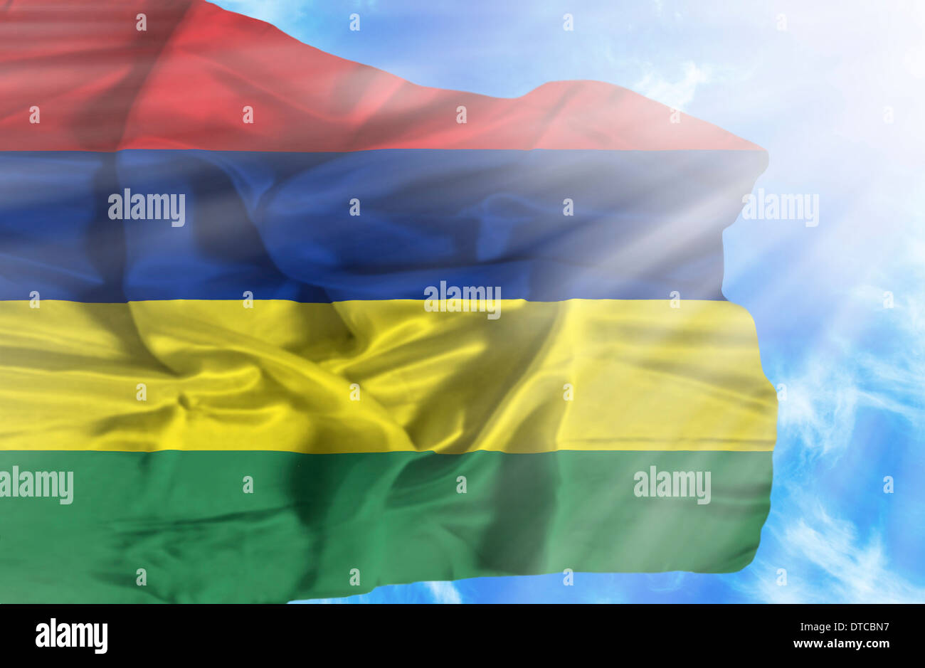 Mauritius waving flag against blue sky with sunrays Stock Photo - Alamy