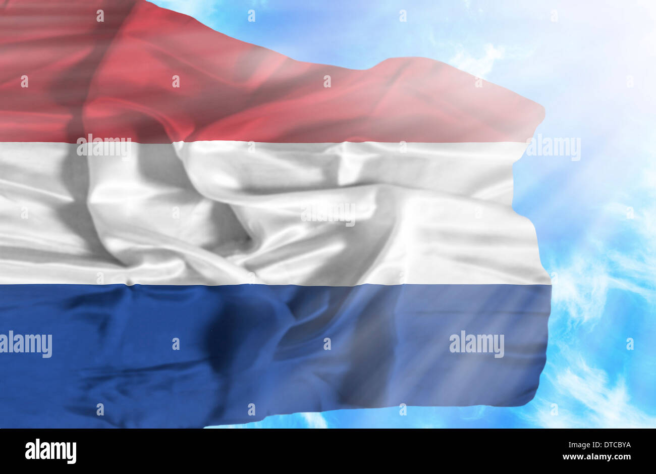 Netherlands waving flag against blue sky with sunrays Stock Photo - Alamy