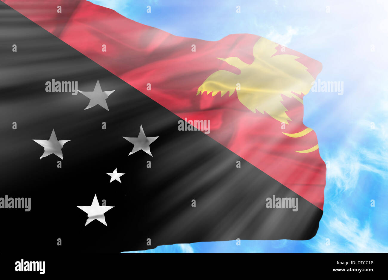 Papua New Guinea waving flag against blue sky with sunrays Stock Photo ...