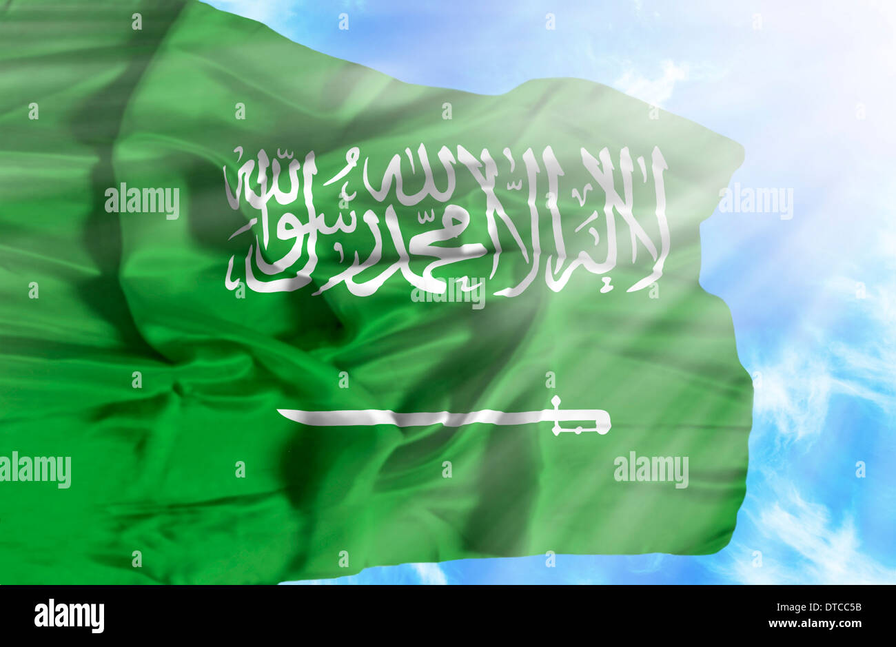 Saudi Arabia waving flag against blue sky with sunrays Stock Photo - Alamy