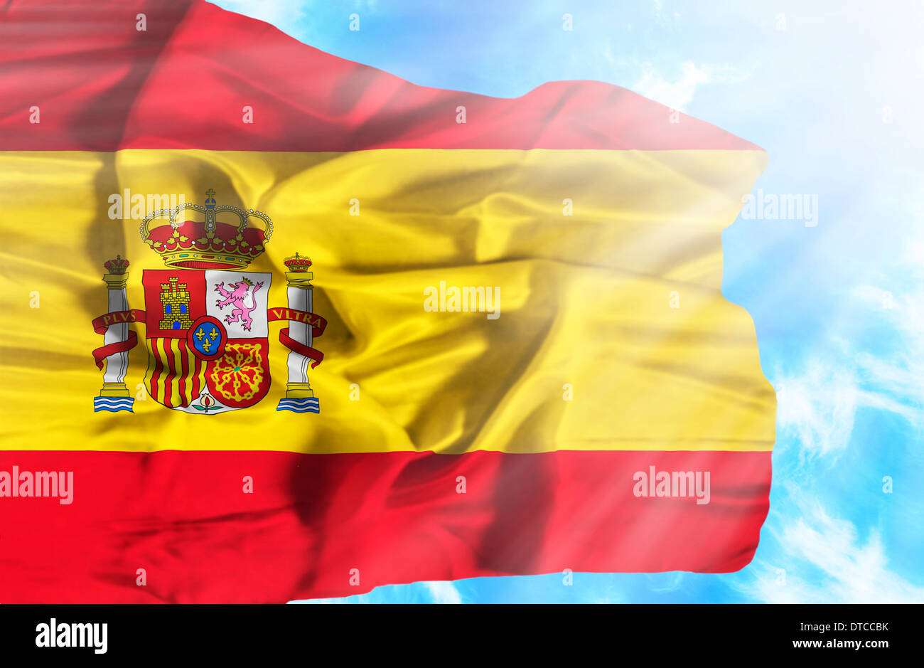 Spain waving flag against blue sky with sunrays Stock Photo - Alamy