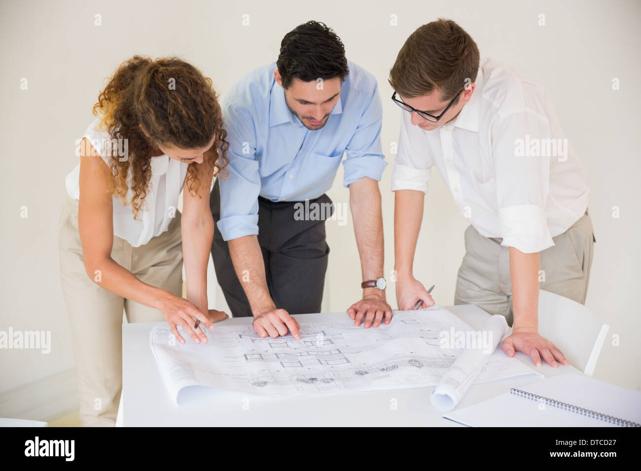 Business people working on blueprint Stock Photo - Alamy