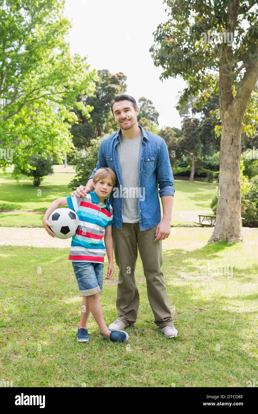 Father and son smiling, soccer ball hi-res stock photography and images ...