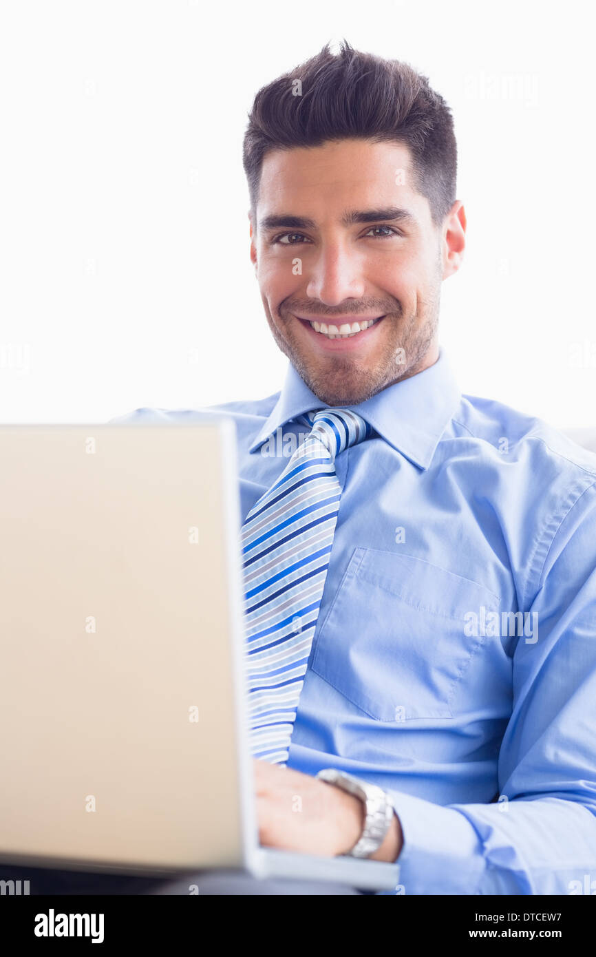 Businessman on couch using hi-res stock photography and images - Alamy