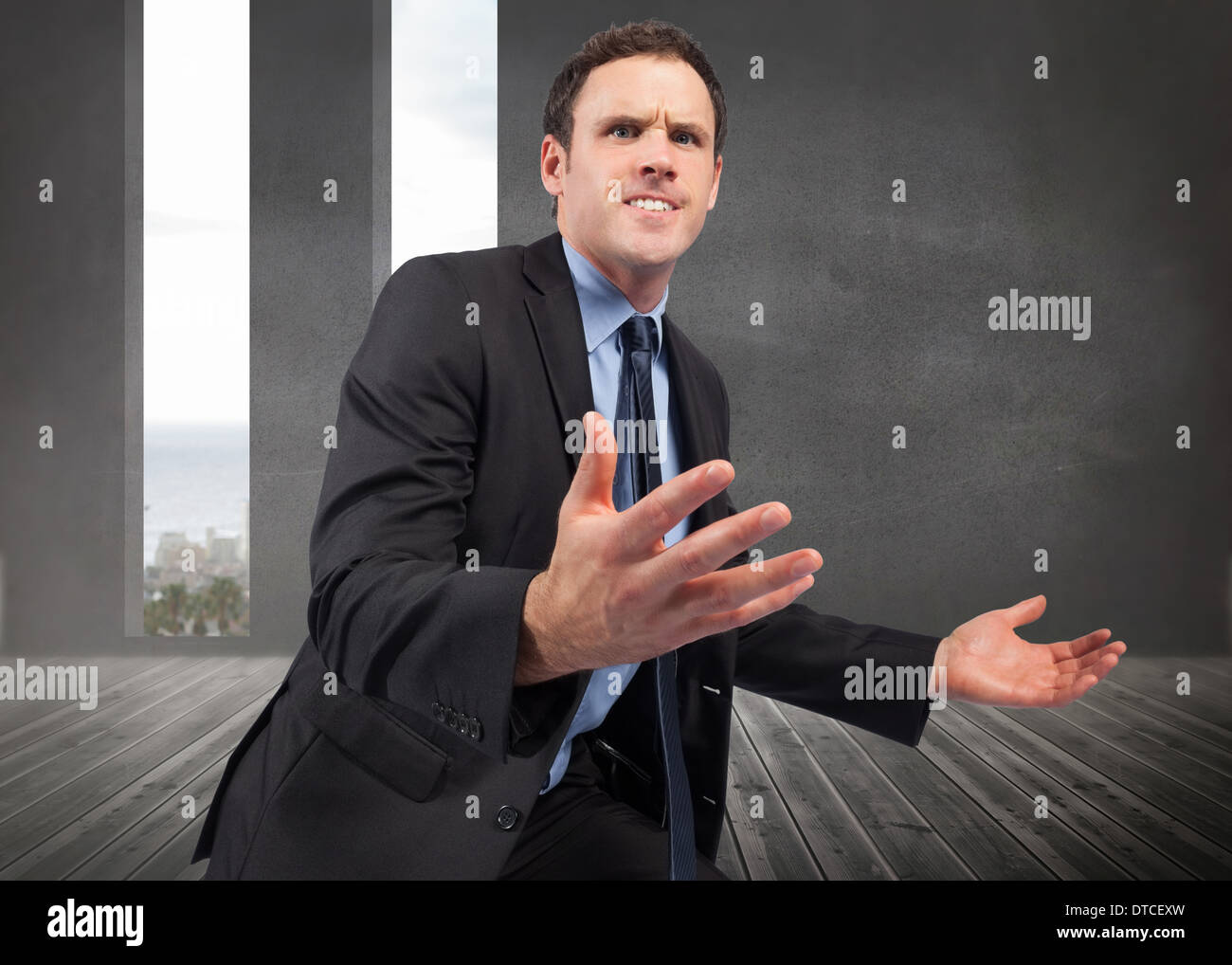 Composite image of businessman posing with arms out Stock Photo - Alamy
