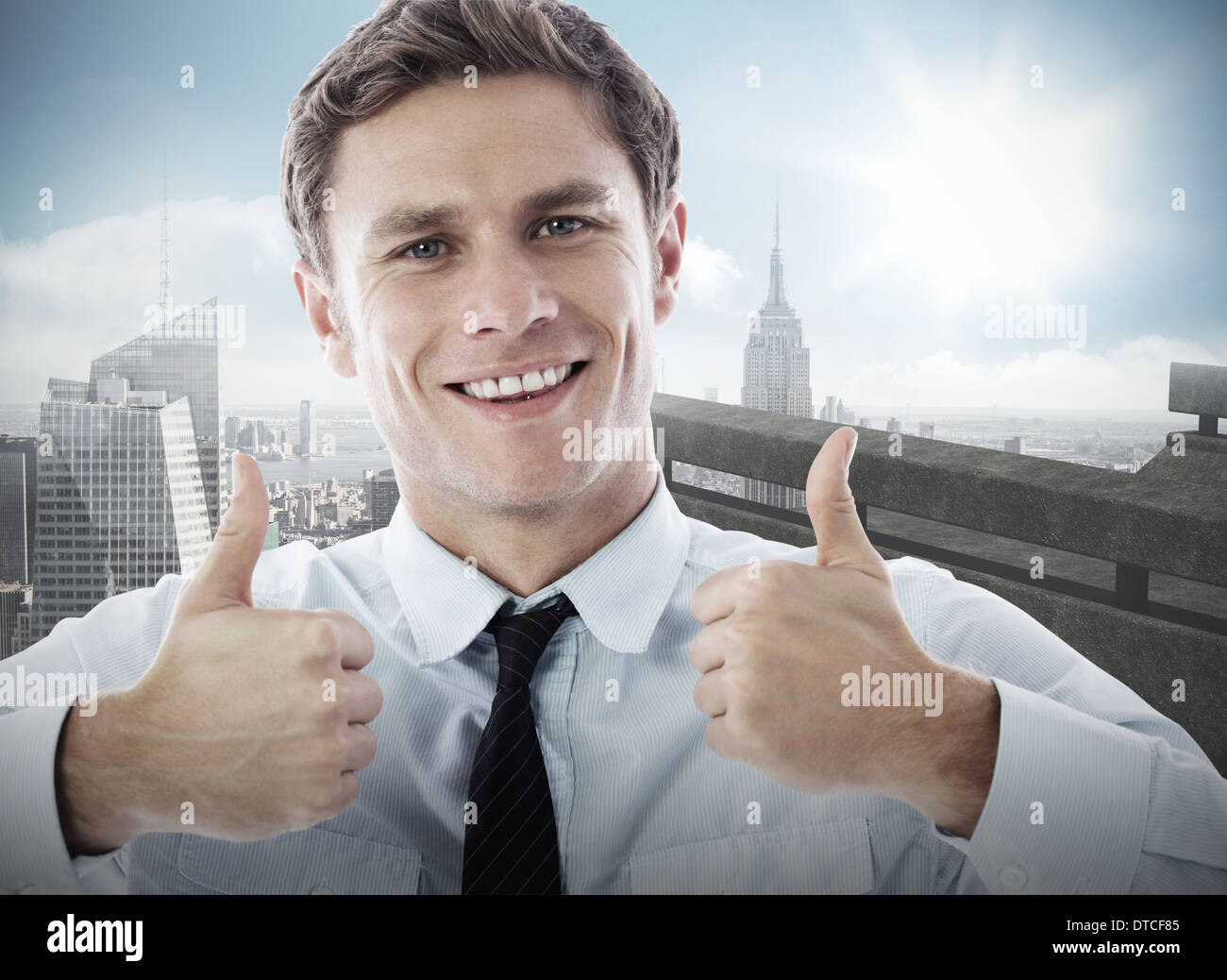 Composite image of businessman showing thumbs up Stock Photo - Alamy