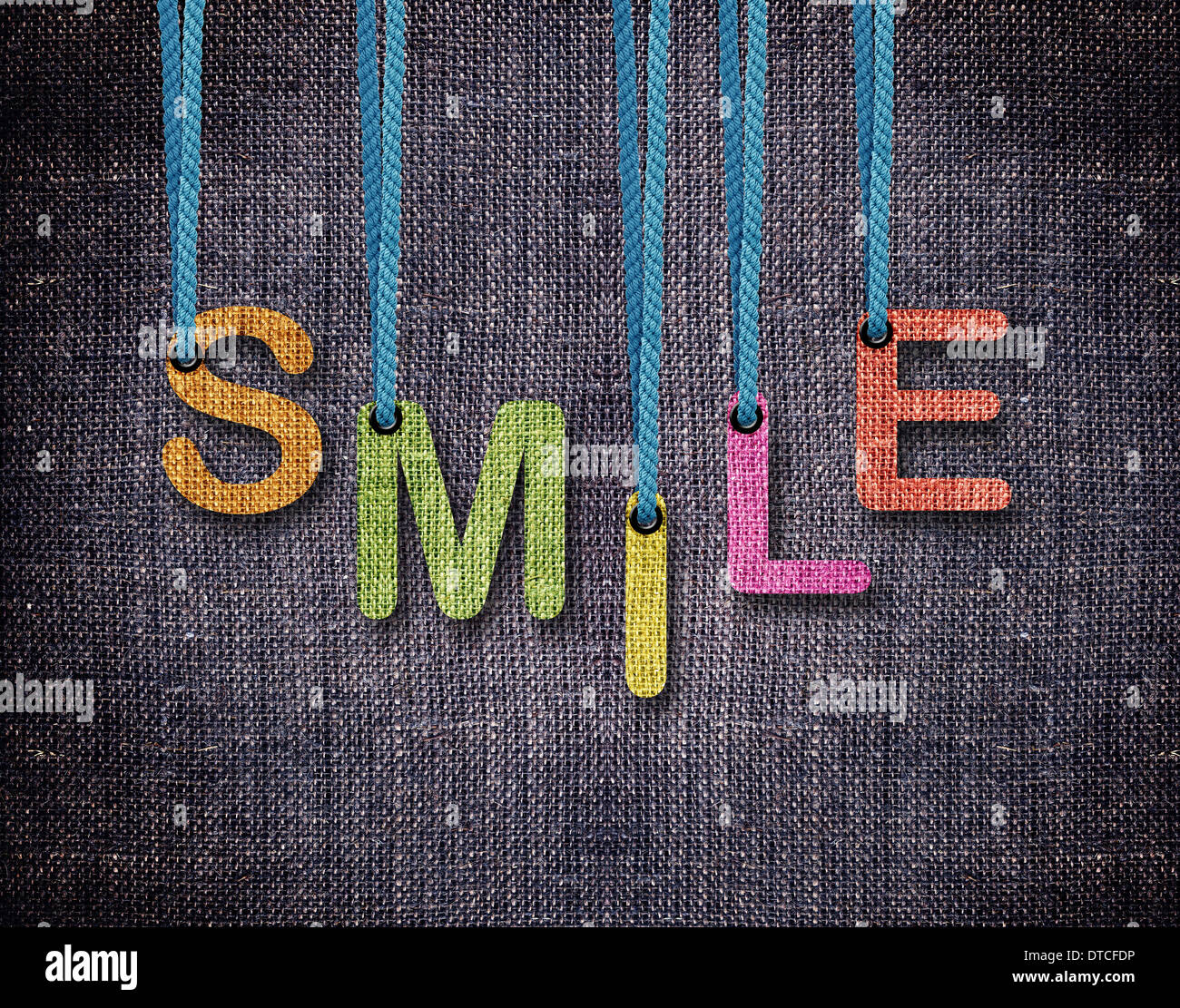 Smile Letters hanging strings with blue sackcloth background Stock ...