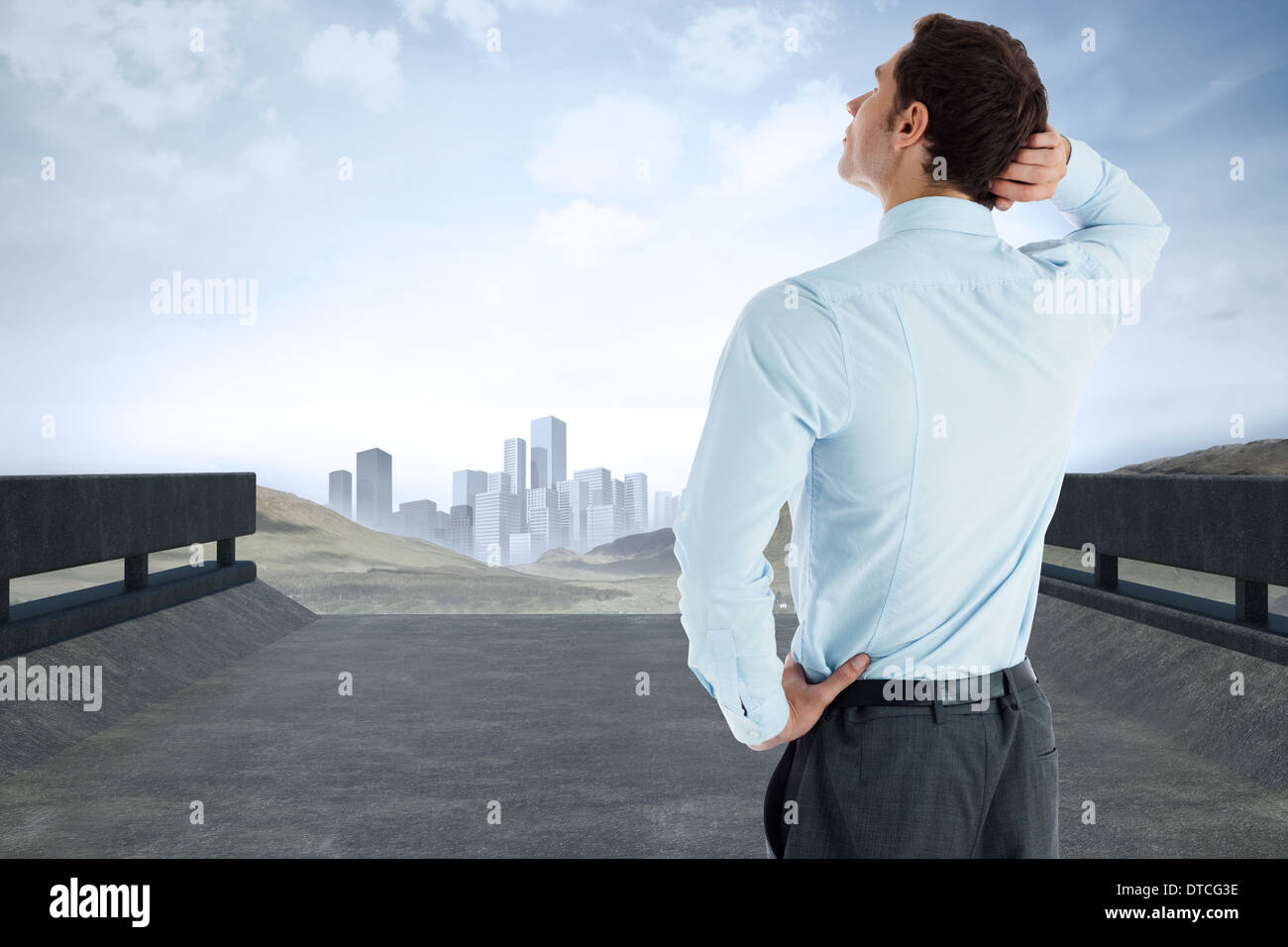Thoughtful businessman with hand on head against steps made of books ...