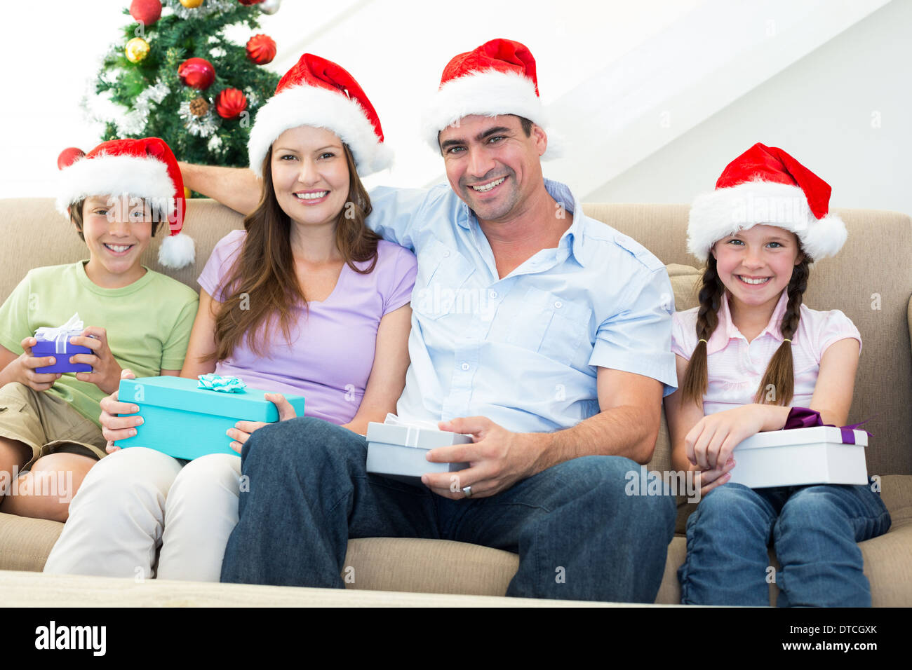 Happy family with Christmas presents Stock Photo - Alamy