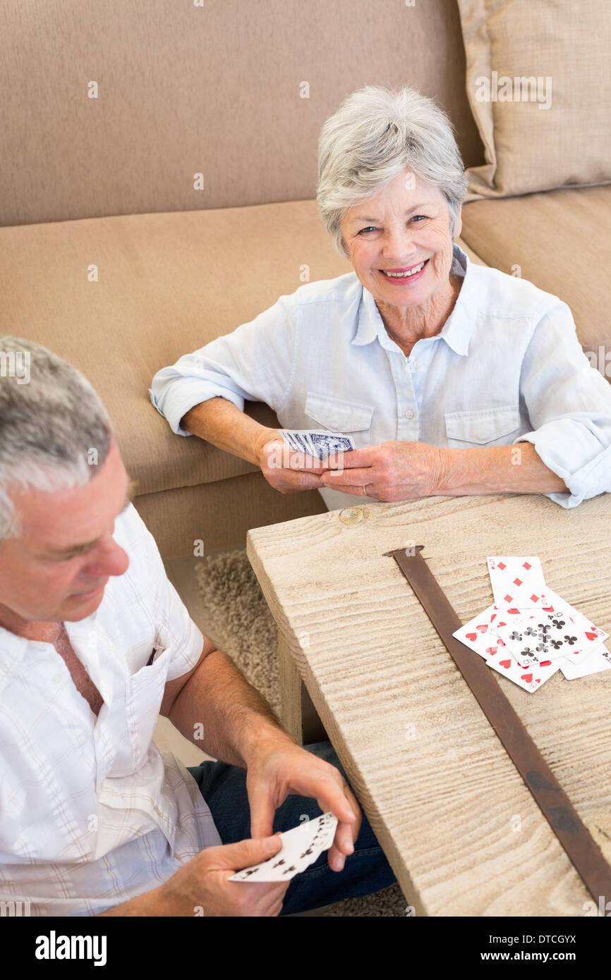 Portrait of happy woman playing card Stock Photo - Alamy