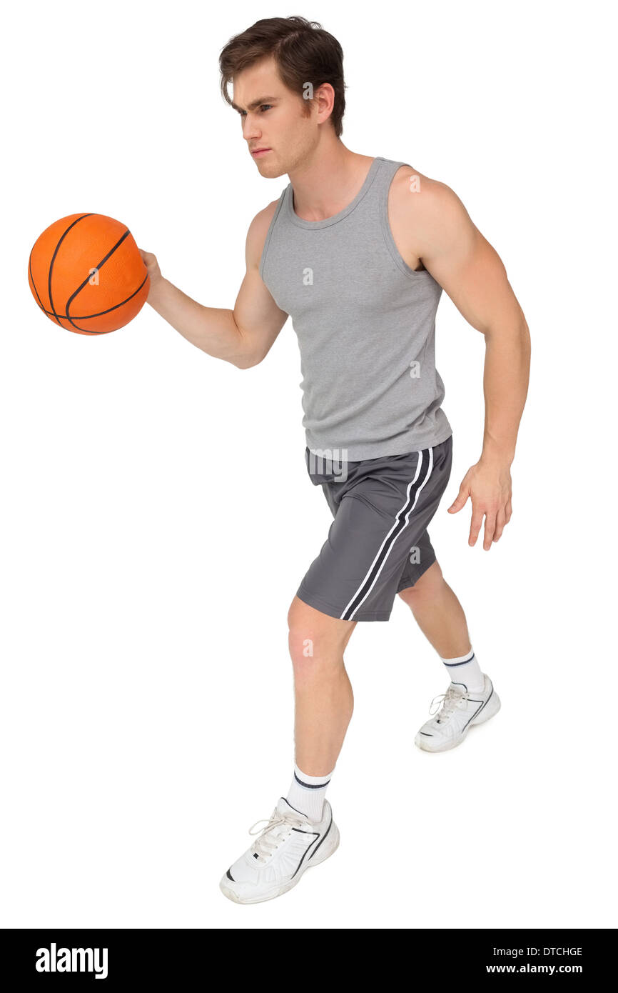 Fit man playing basketball Stock Photo - Alamy