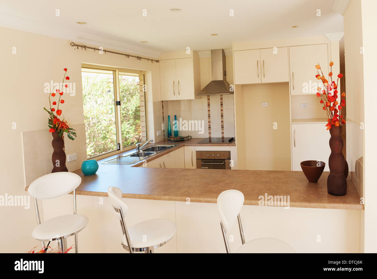 light kitchen in a new modern home Stock Photo - Alamy