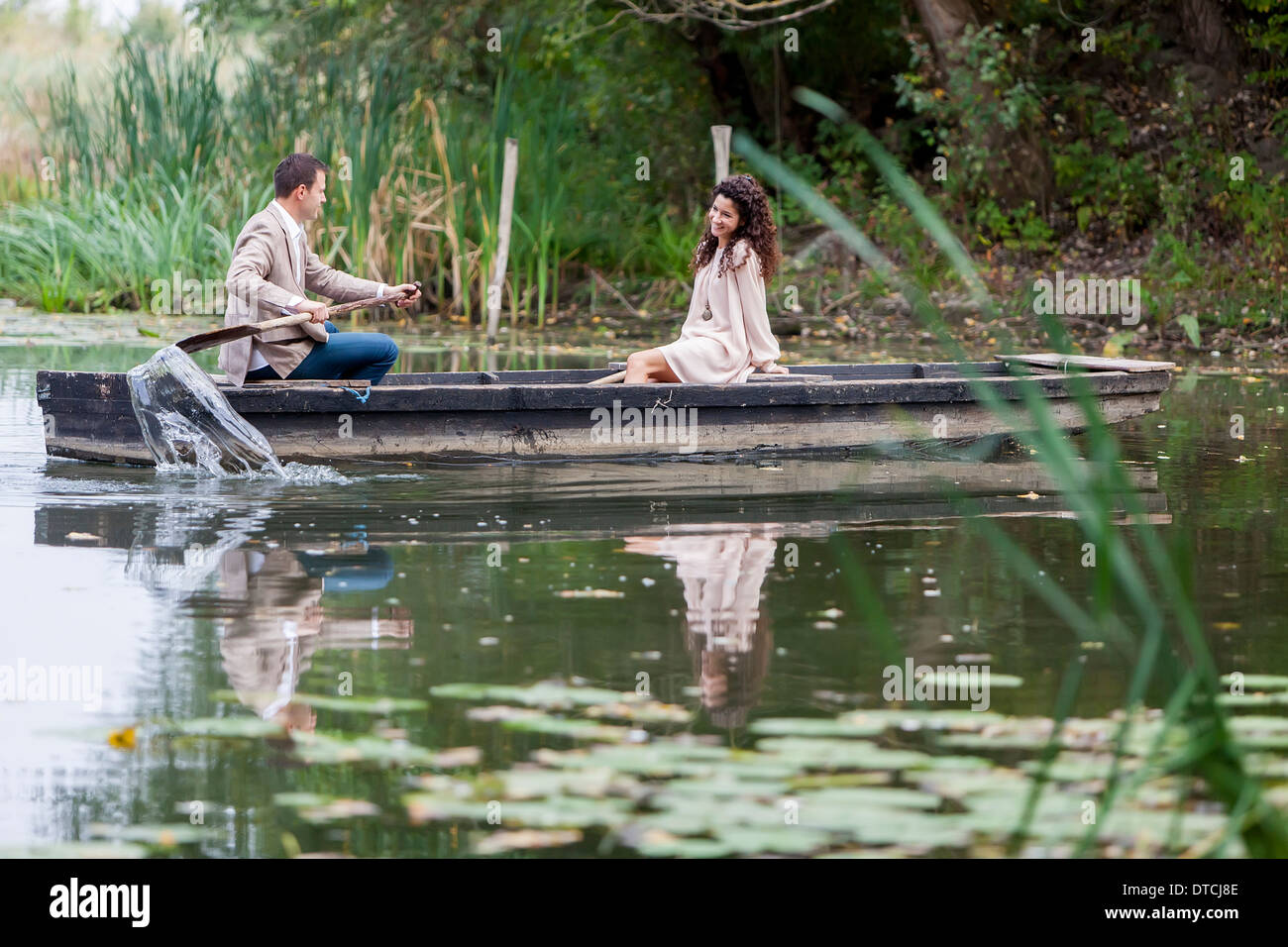 Loving couple in the boat Stock Photo - Alamy