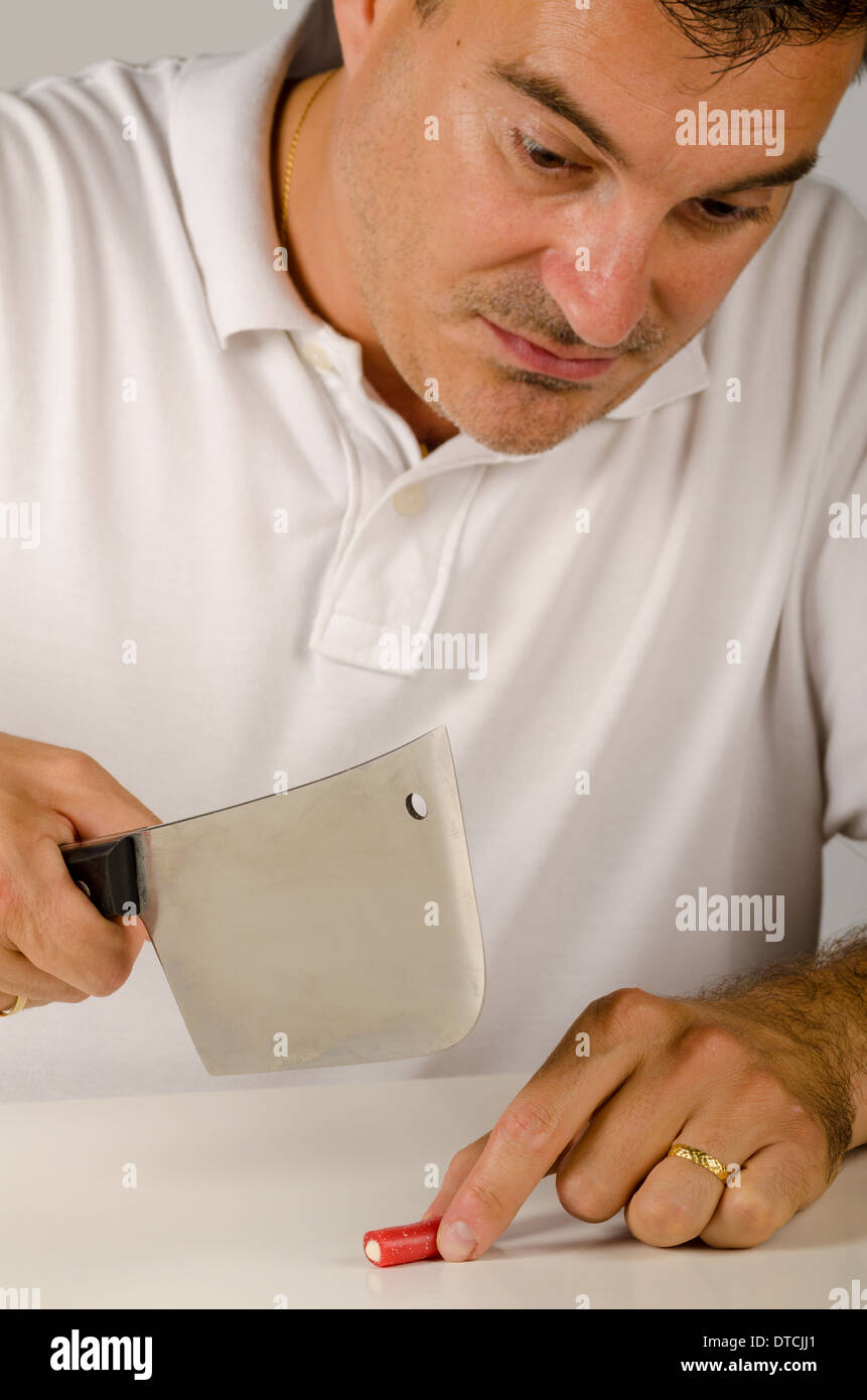 Size matters, a concept with a guy trying to chop a tiny thing with a ...