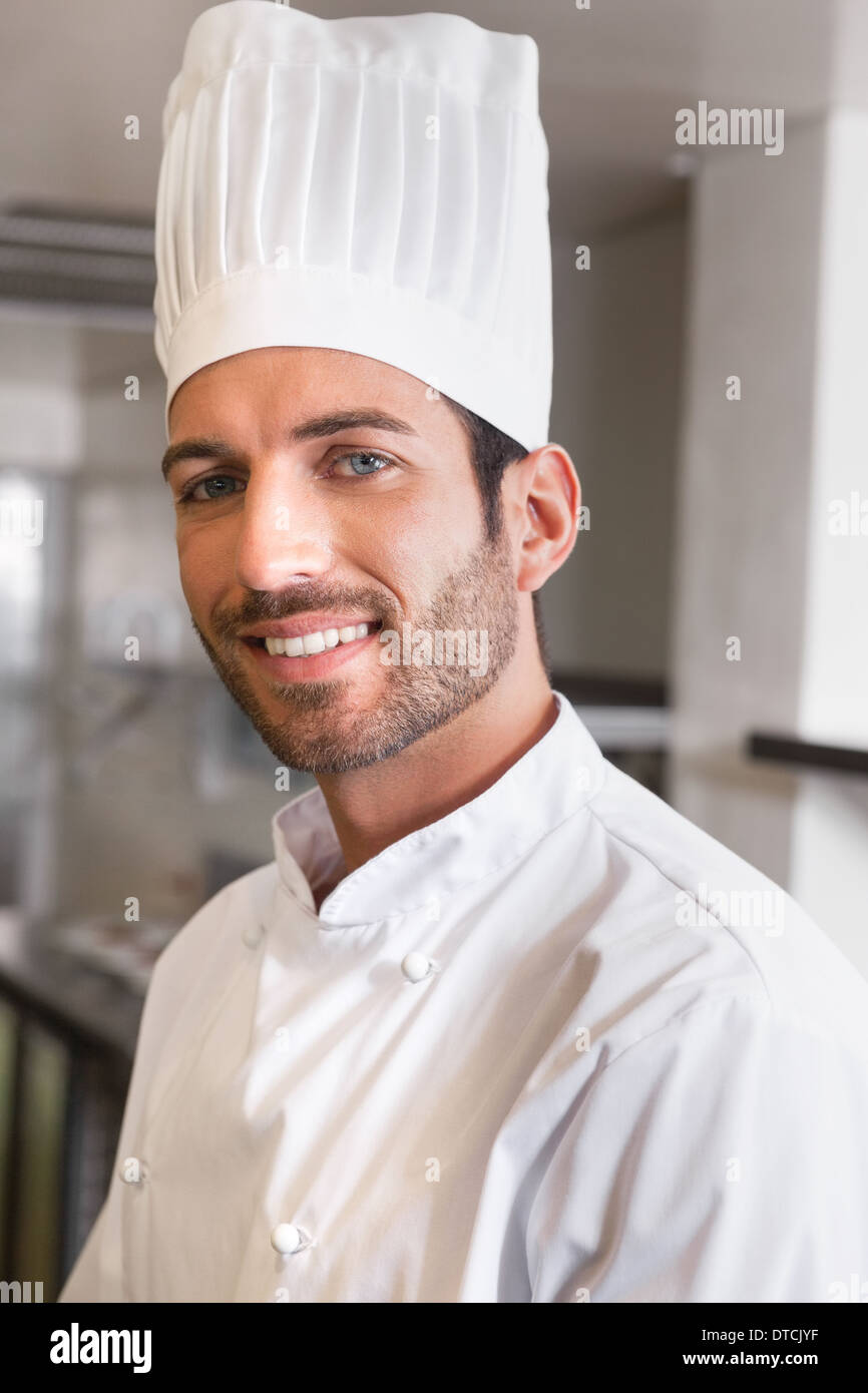 Happy young chef smiling at camera Stock Photo - Alamy