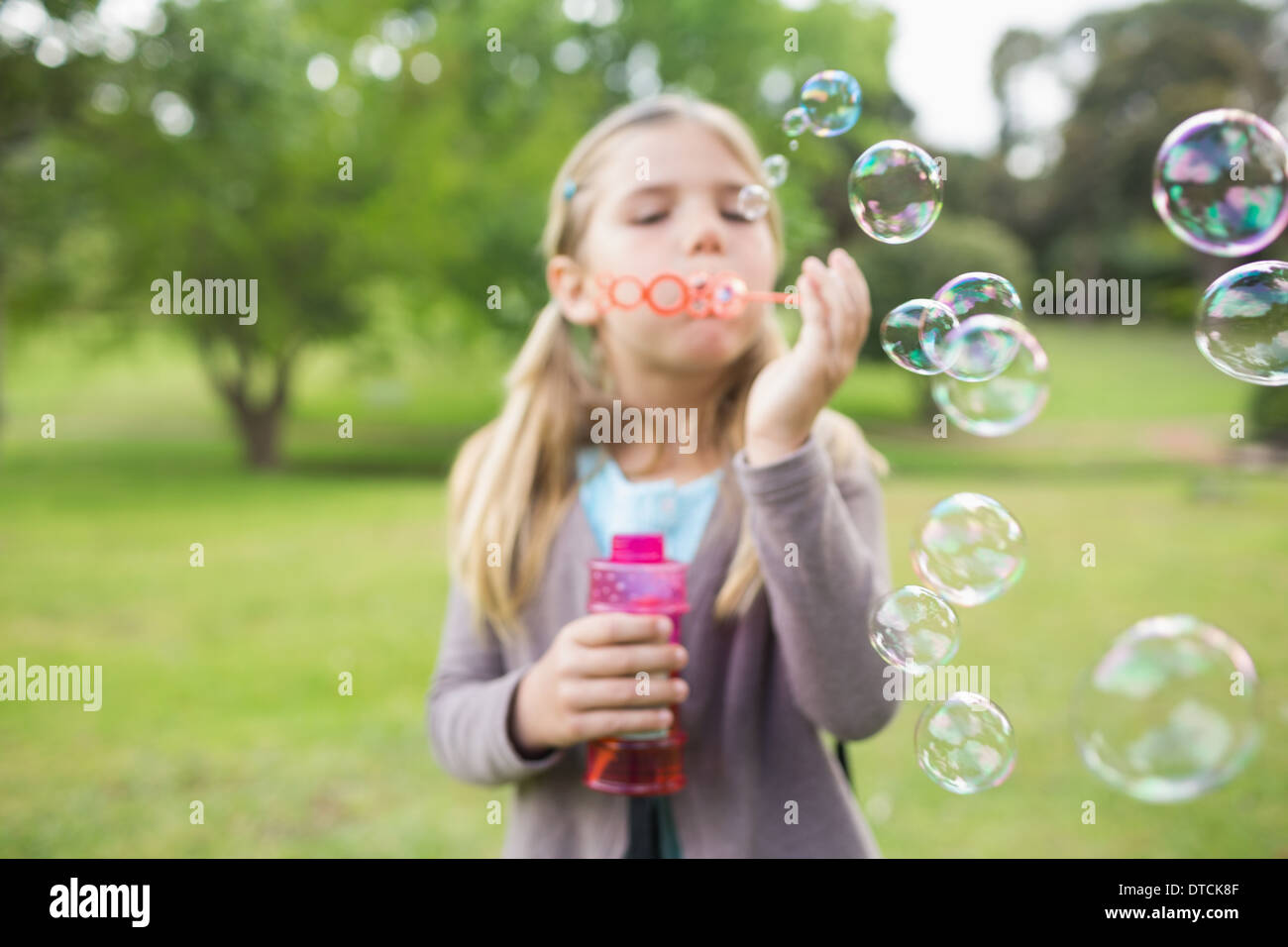 Beautiful female blowing soap bubbles hi-res stock photography and ...
