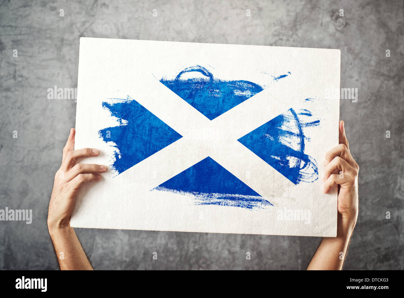 Scotland flag. Man holding banner with Scotish Flag. Supporting ...