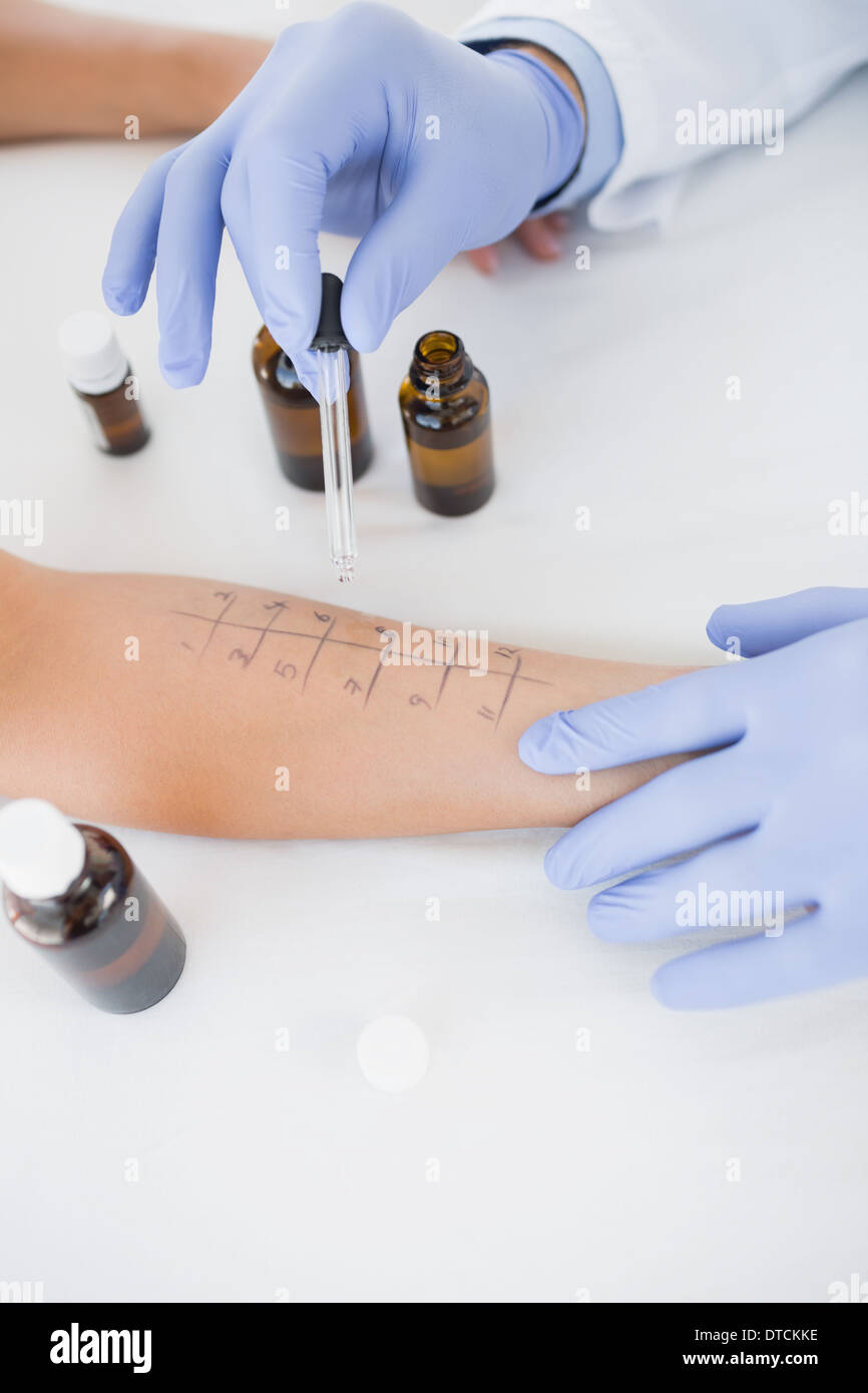 Doctor dropping medicine on hand of patient Stock Photo - Alamy