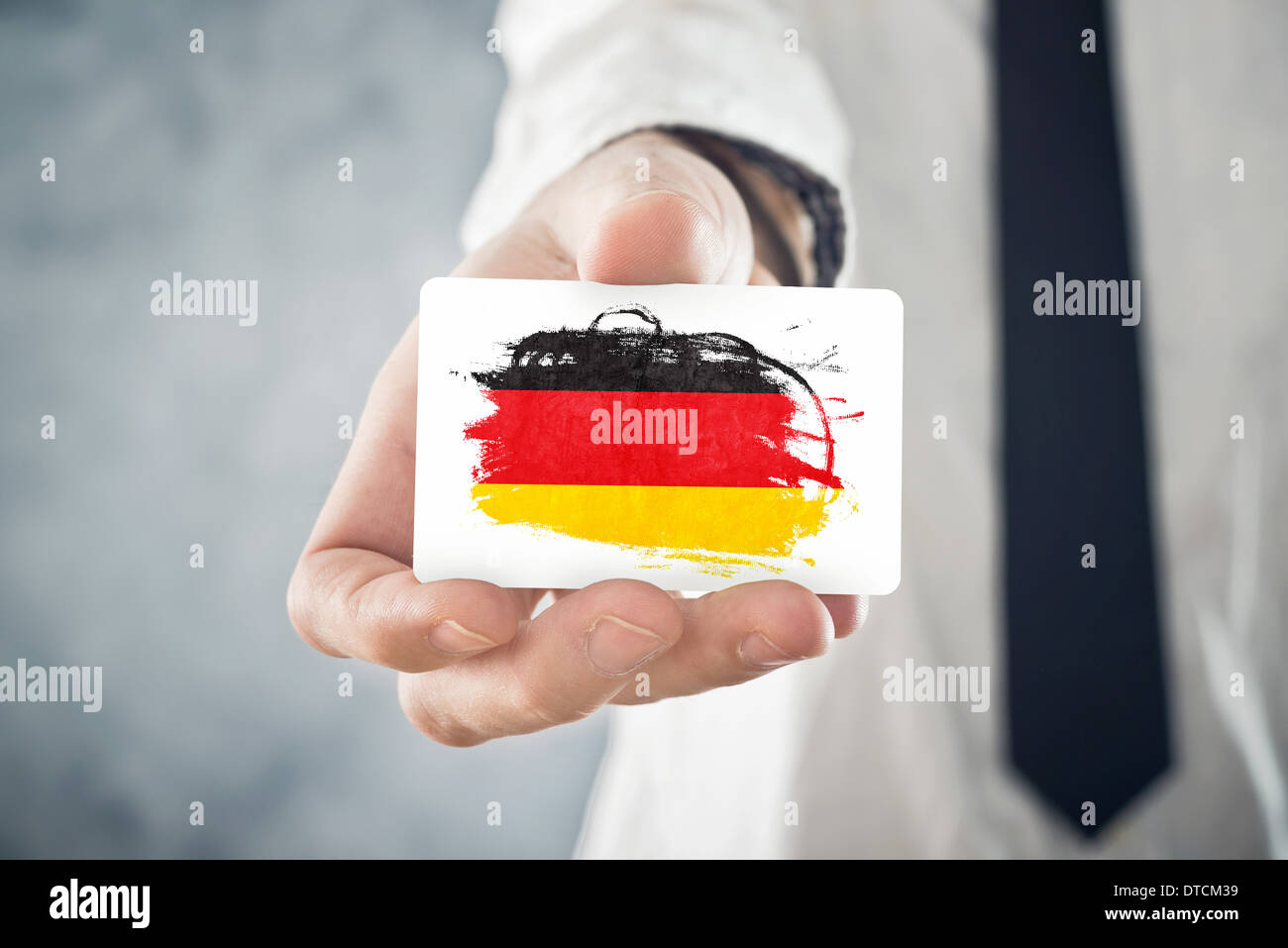 German Businessman holding business card with Germany Flag ...