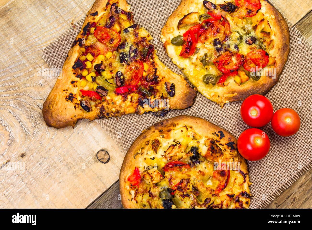 Closeup of a heavily toasted slices of pizza Stock Photo - Alamy