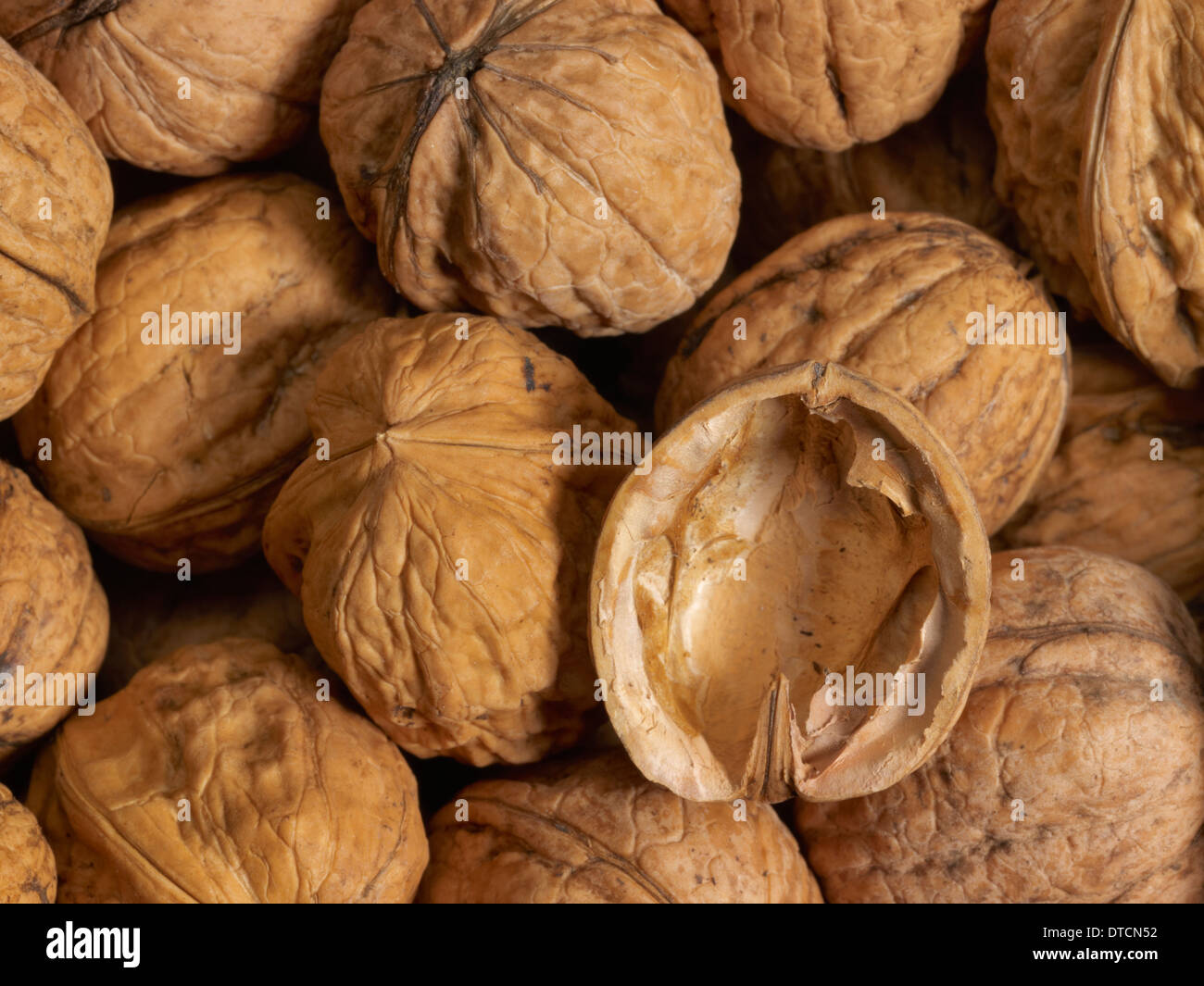 full frame walnut background and open nutshell Stock Photo - Alamy