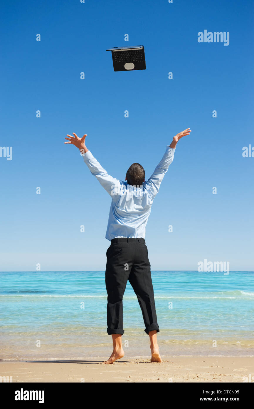 Dreams come true. First day of vacation.Businessman on the beach Stock ...