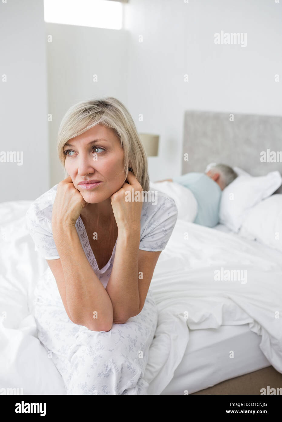 Mature woman sitting in bed hi-res stock photography and images - Alamy