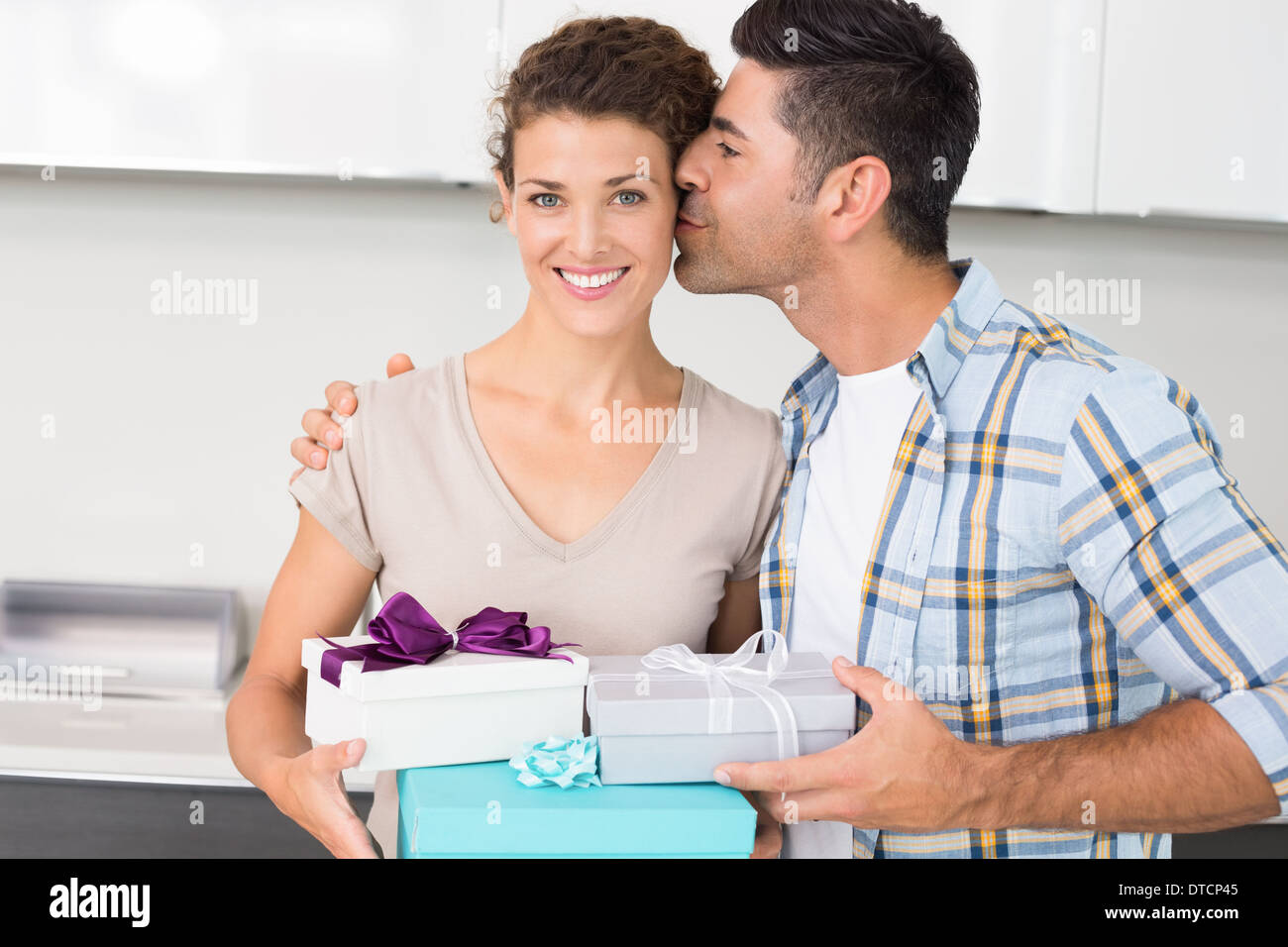 Happy young woman with many gifts hi-res stock photography and images ...