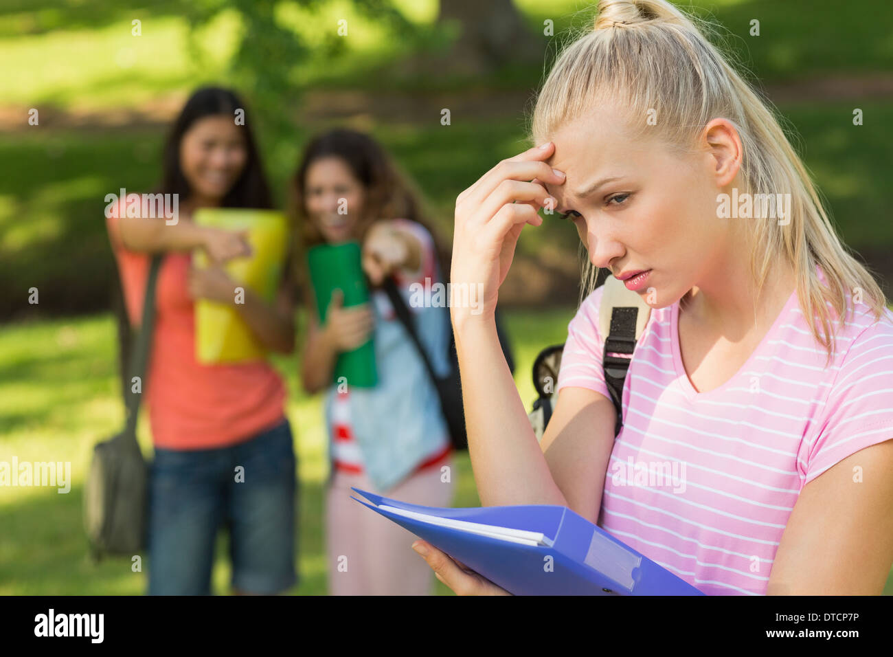 Female being bullied by group of students Stock Photo - Alamy