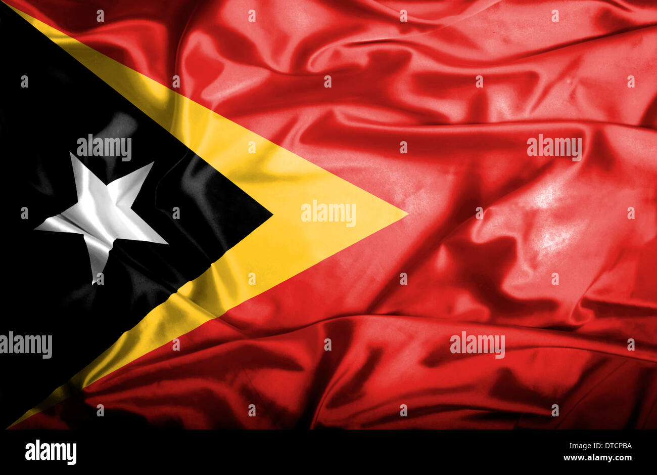 East Timor waving flag Stock Photo - Alamy