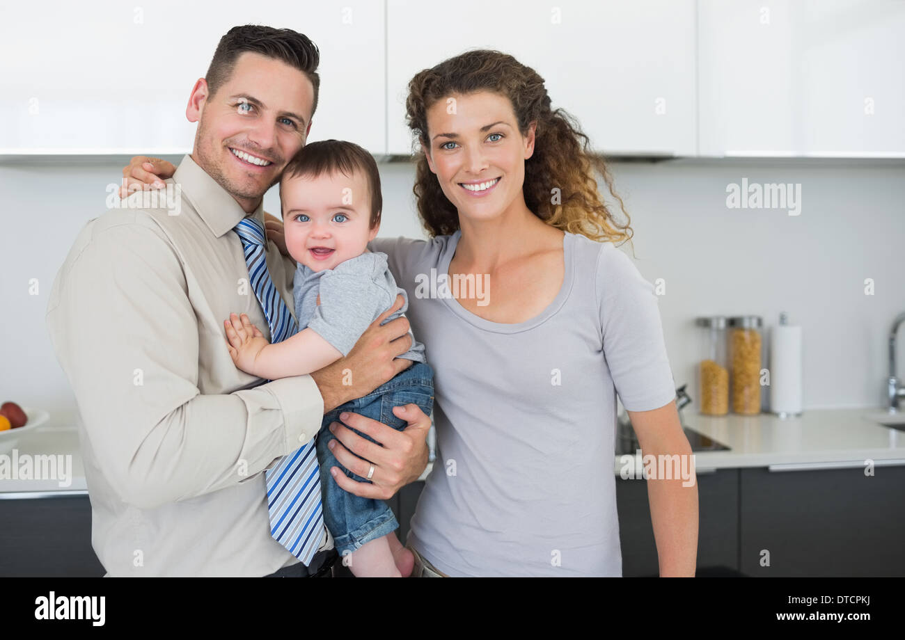Smiling parents with cute baby boy Stock Photo - Alamy