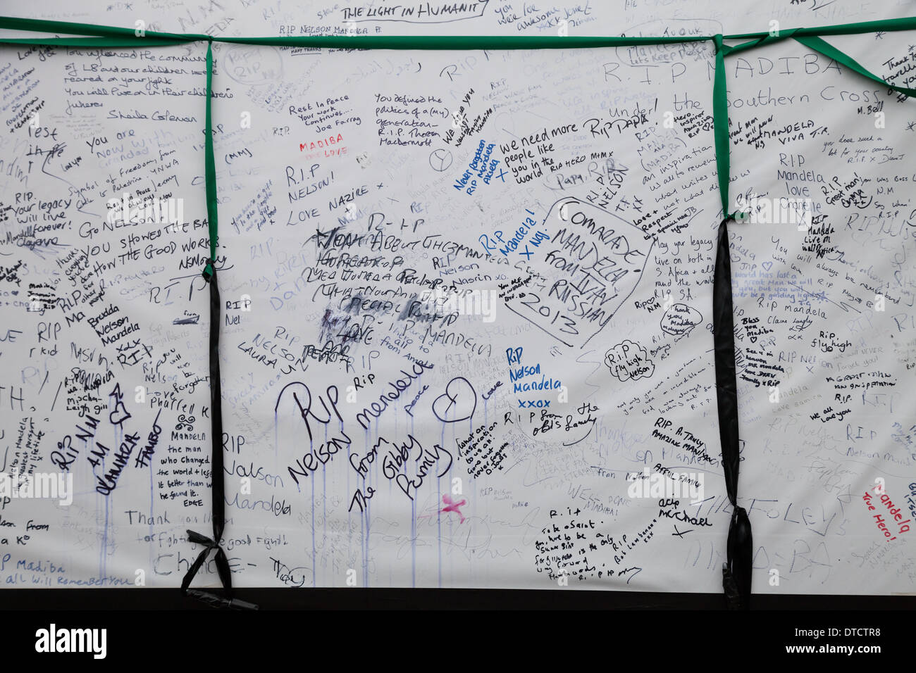 Tributes to Nelson Mandela left on a wall near Princes Park gates in ...