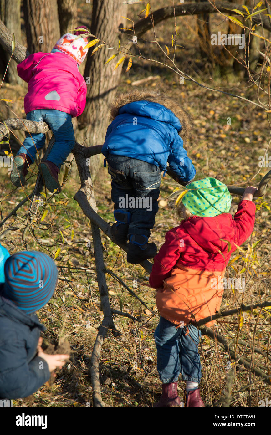 Berlin, Germany, children climb a tree Stock Photo - Alamy