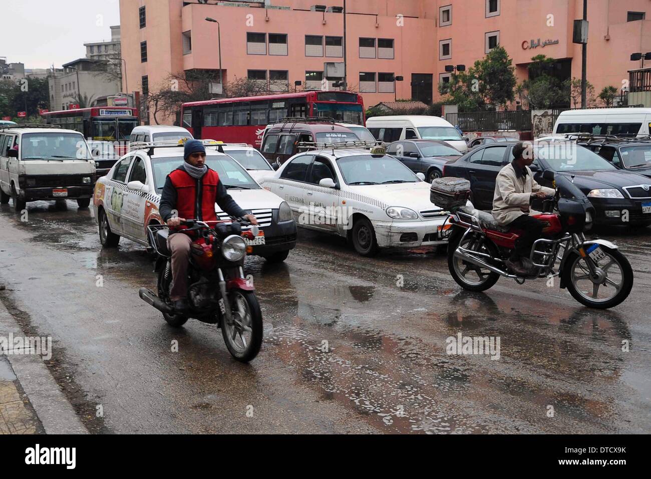 Cairo, Cairo, Egypt. 15th Feb, 2014. Egyptians ride a motorbikes on a ...