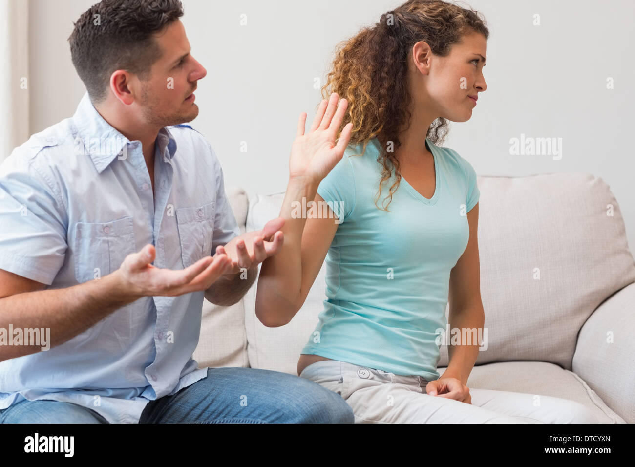 Couple arguing in living room Stock Photo - Alamy
