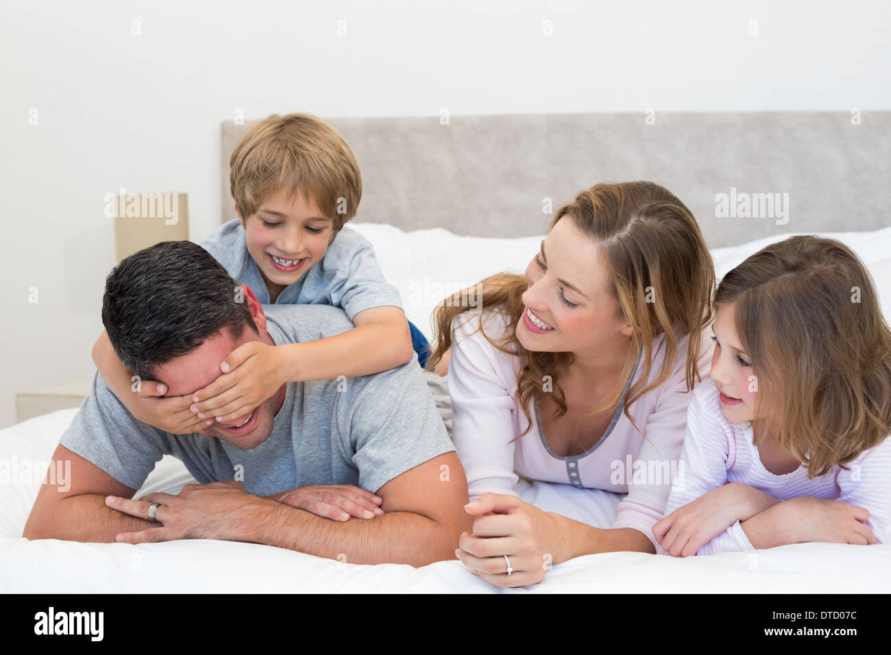 Children covering parents eyes hi-res stock photography and images - Alamy