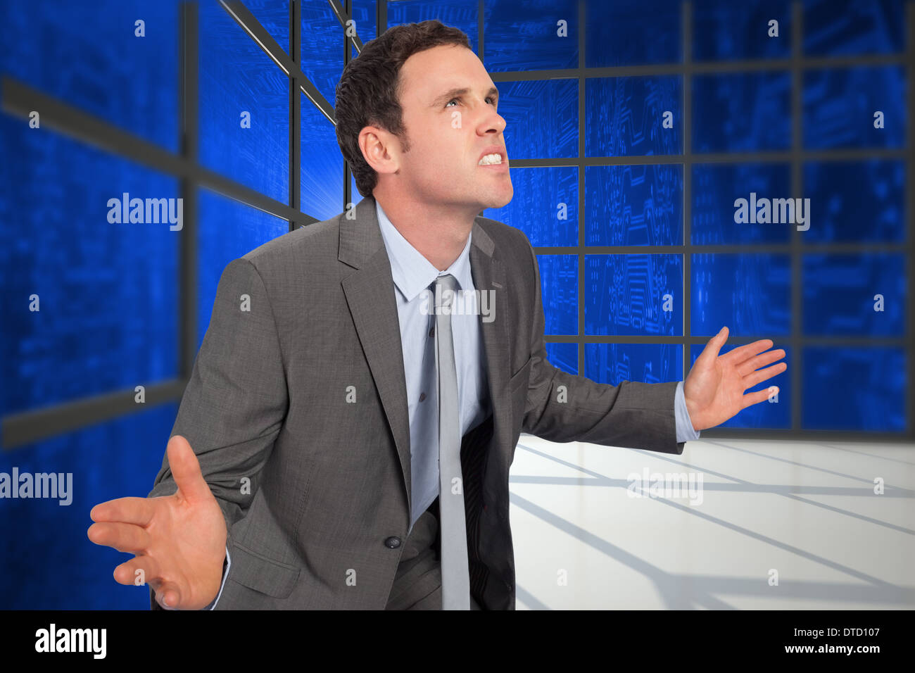 Composite image of businessman posing with hands out Stock Photo - Alamy