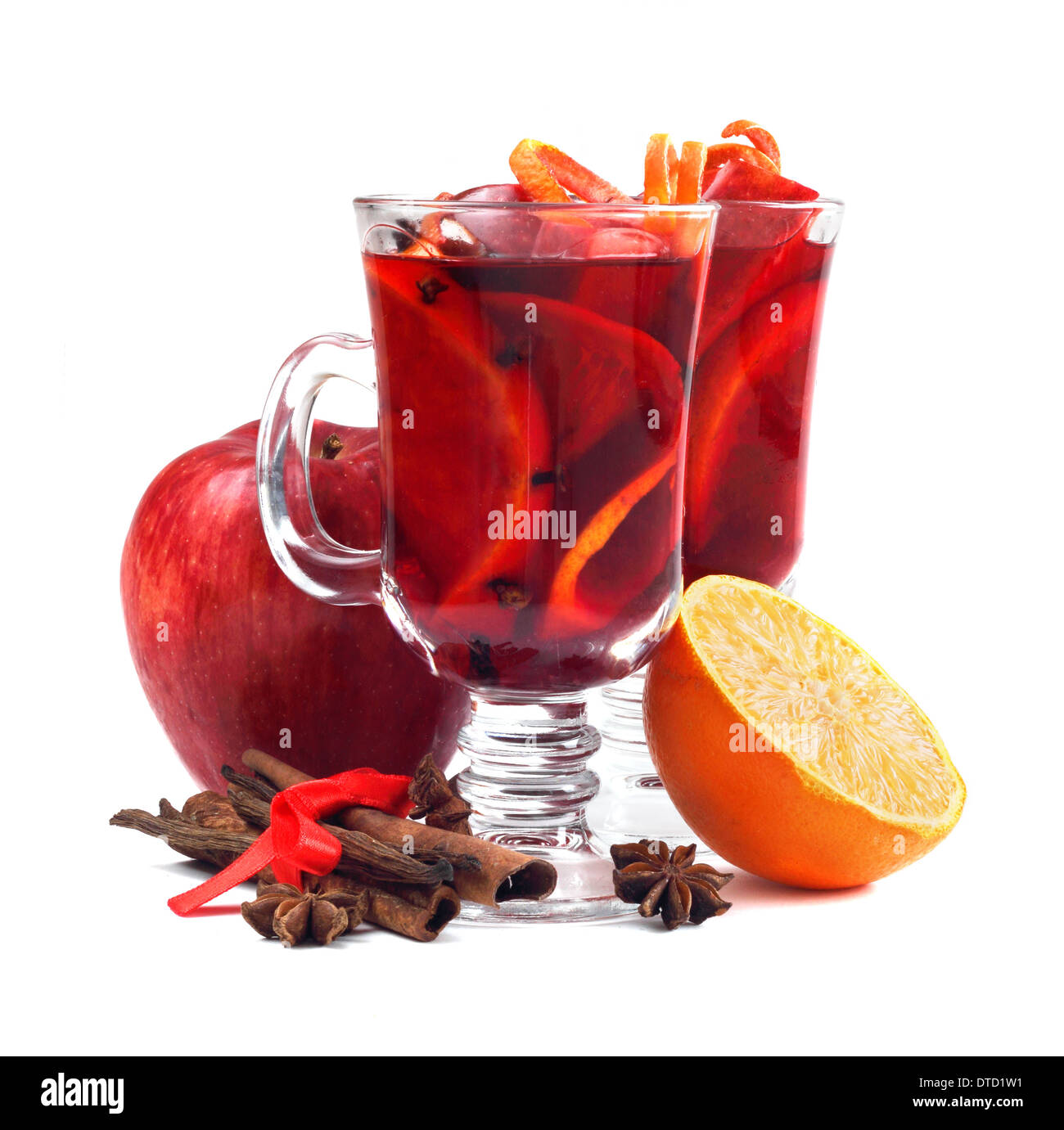 Hot red mulled wine with fruits and cinnamon isolated on white ...