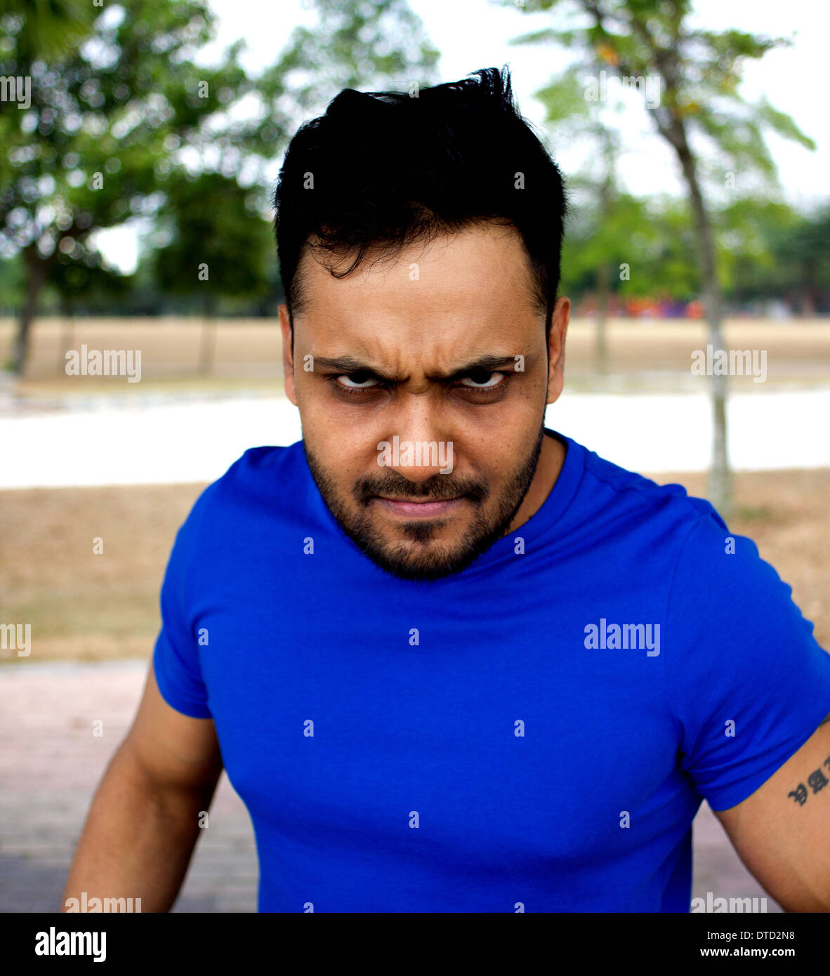 Ethnic Indian male staring in anger Stock Photo - Alamy
