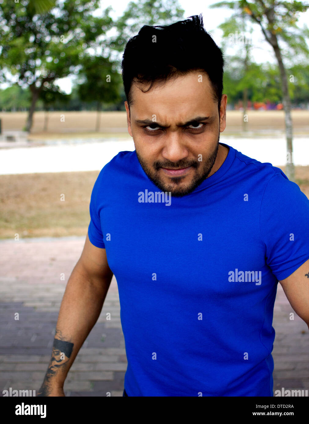 Ethnic Indian male staring in anger Stock Photo - Alamy