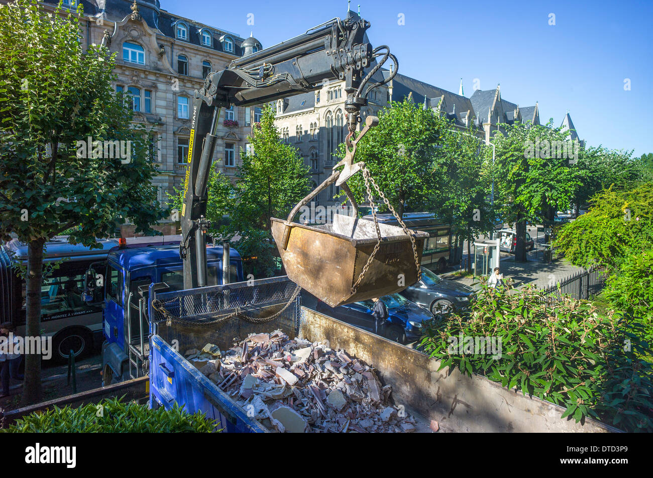 Crane loading construction rubble into truck Strasbourg Alsace France ...