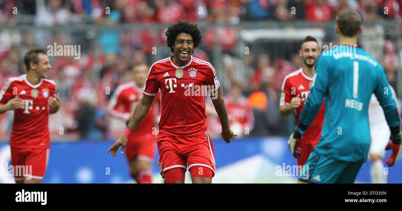 Munich, Germany. 15th Feb, 2014. Munich's Dante (C) celebrates his 1-0 ...