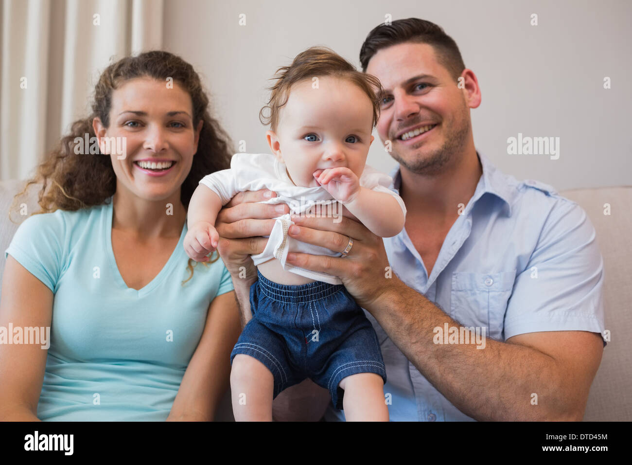 Happy parents with cute baby boy Stock Photo - Alamy