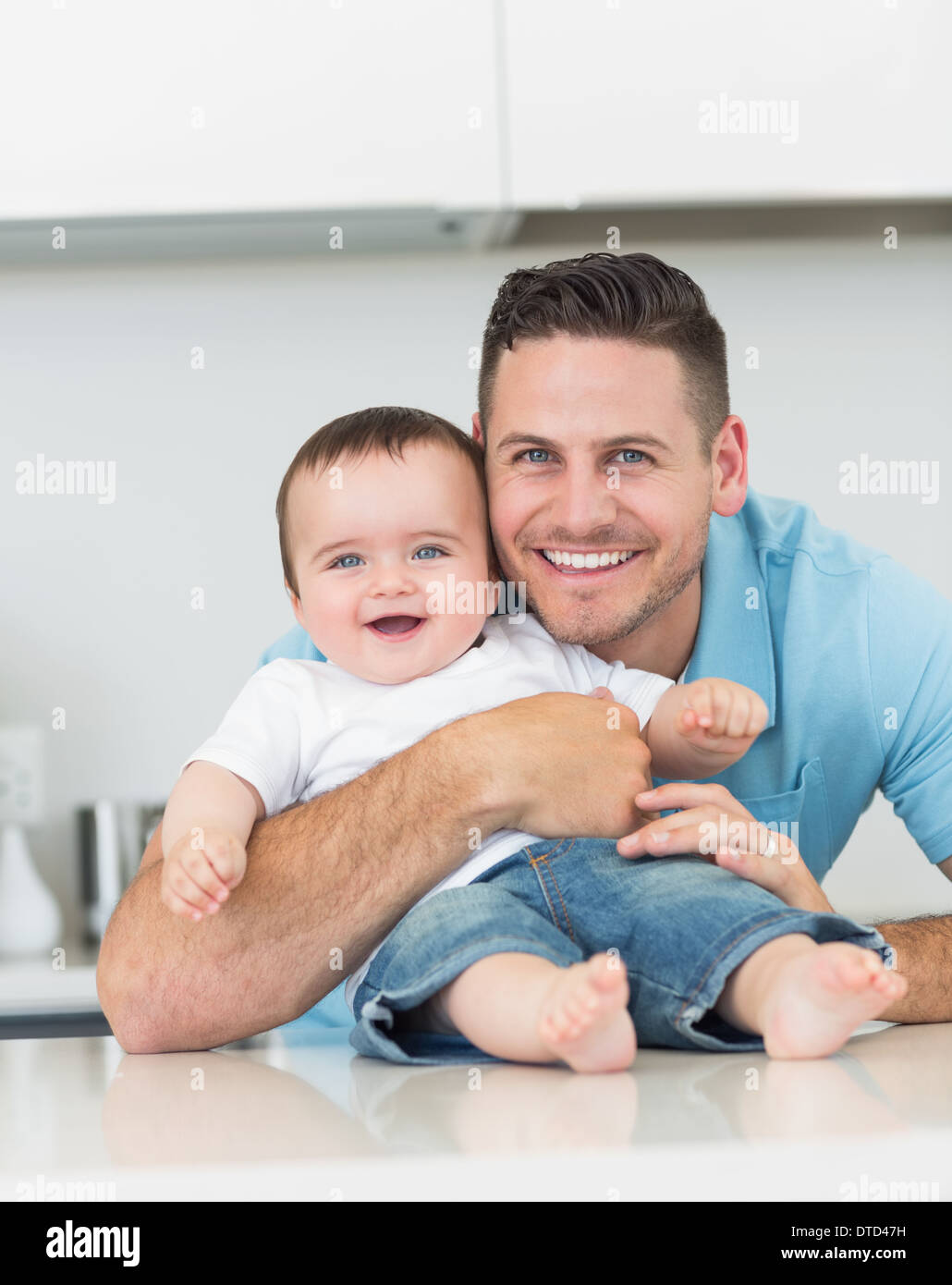 Happy father embracing baby Stock Photo - Alamy