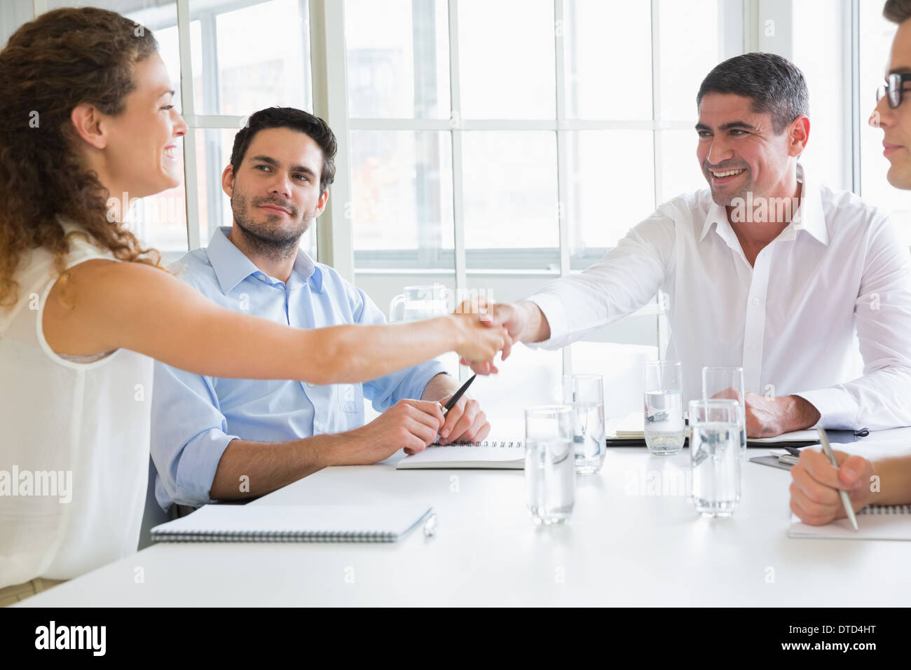 Handshake business partners table hi-res stock photography and images ...