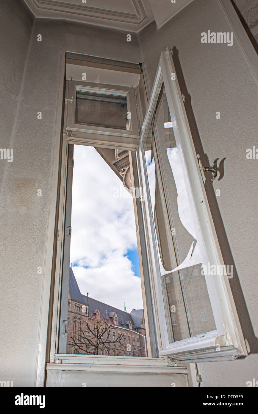 Home window with broken glass Stock Photo - Alamy