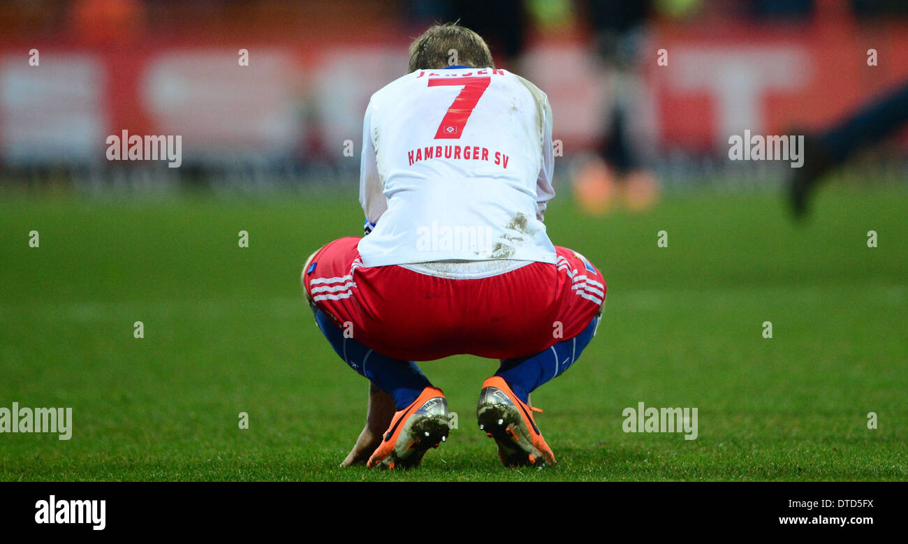 Braunschweig, Germany. 15th Feb, 2014. Hamburg's Marcell Jansen kneels ...