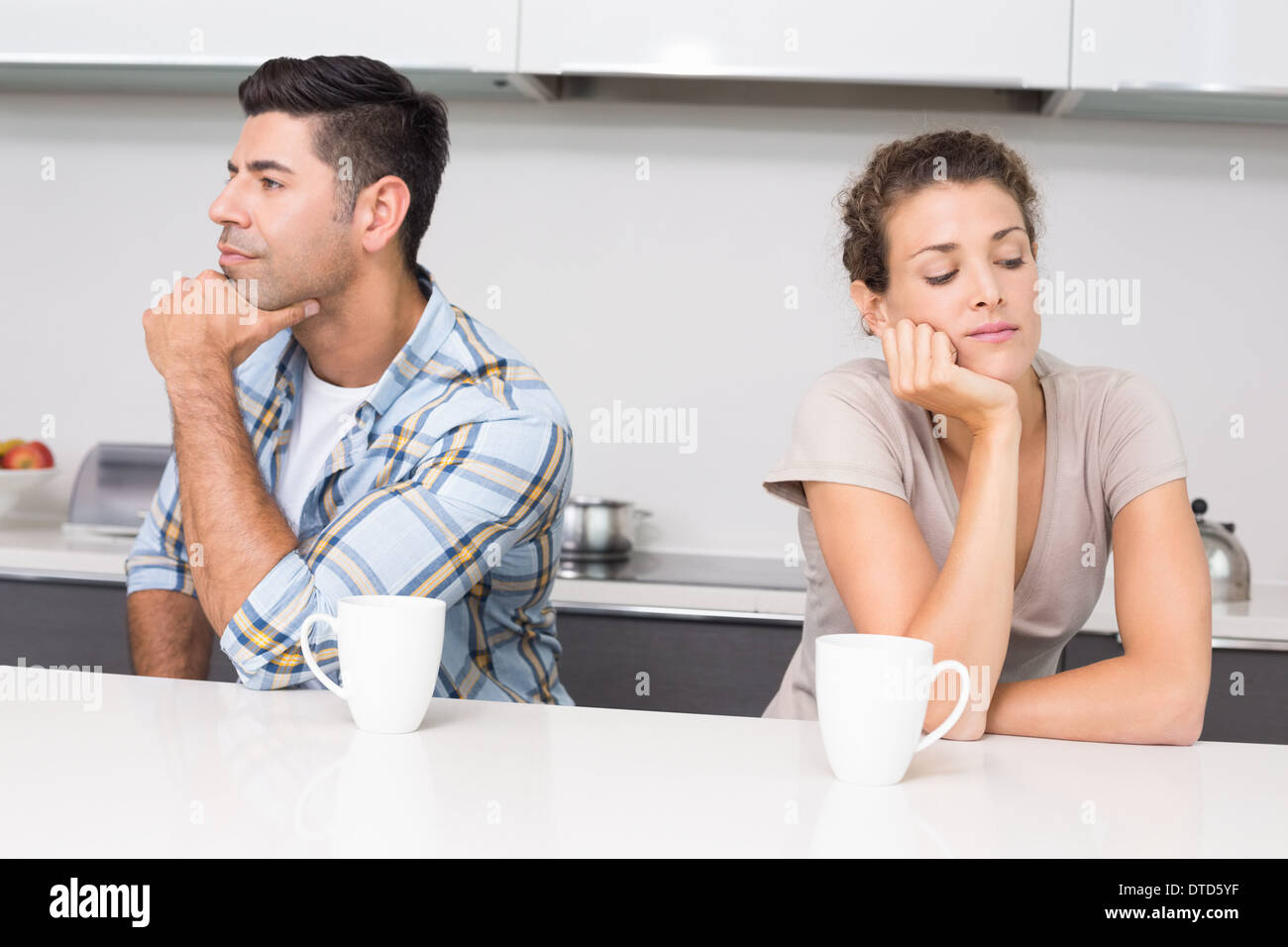 Unhappy couple having coffee not talking Stock Photo - Alamy